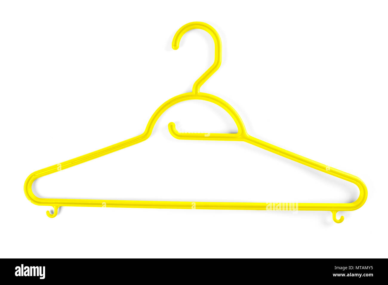 Yellow plastic hanger for clothes on a white background Stock Photo - Alamy