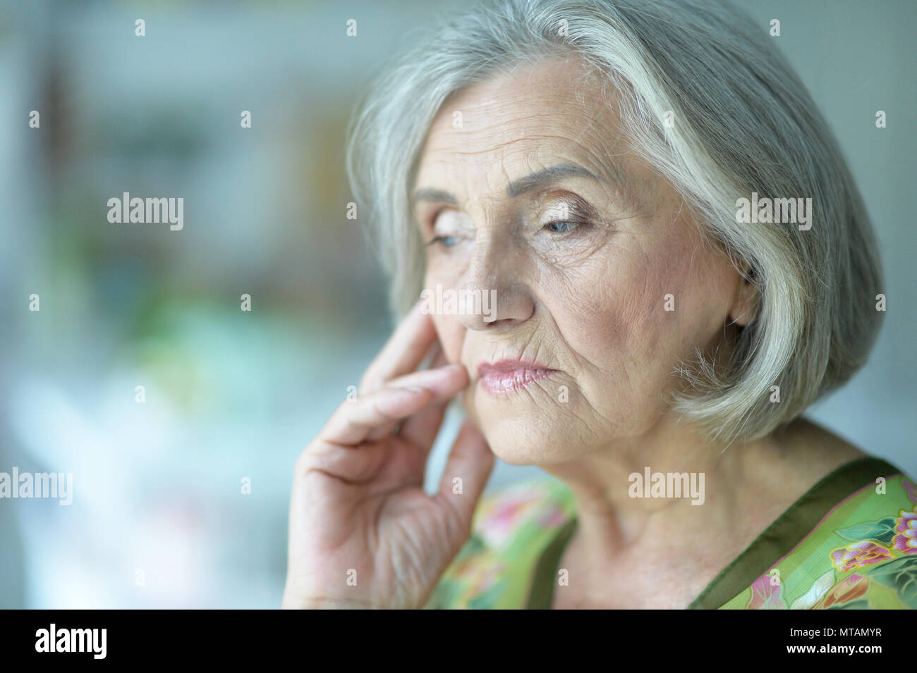 Close up portrait of tired senior woman Stock Photo - Alamy