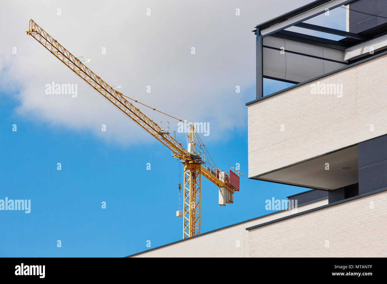 Modern building and crane machinery structure. Construction industry ...