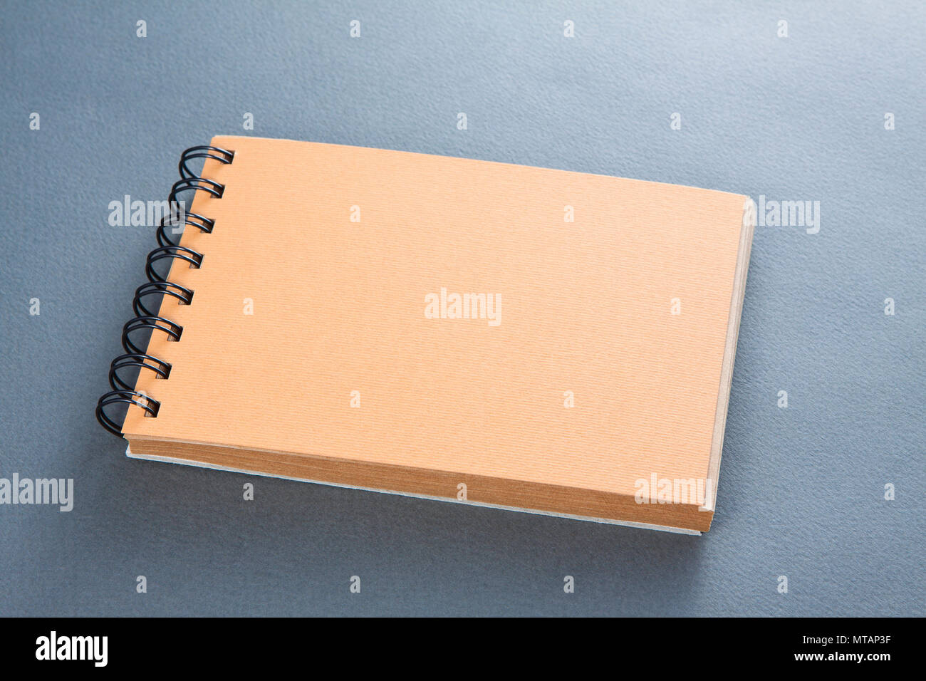 recycled paper notebook front cover, gray background Stock Photo - Alamy