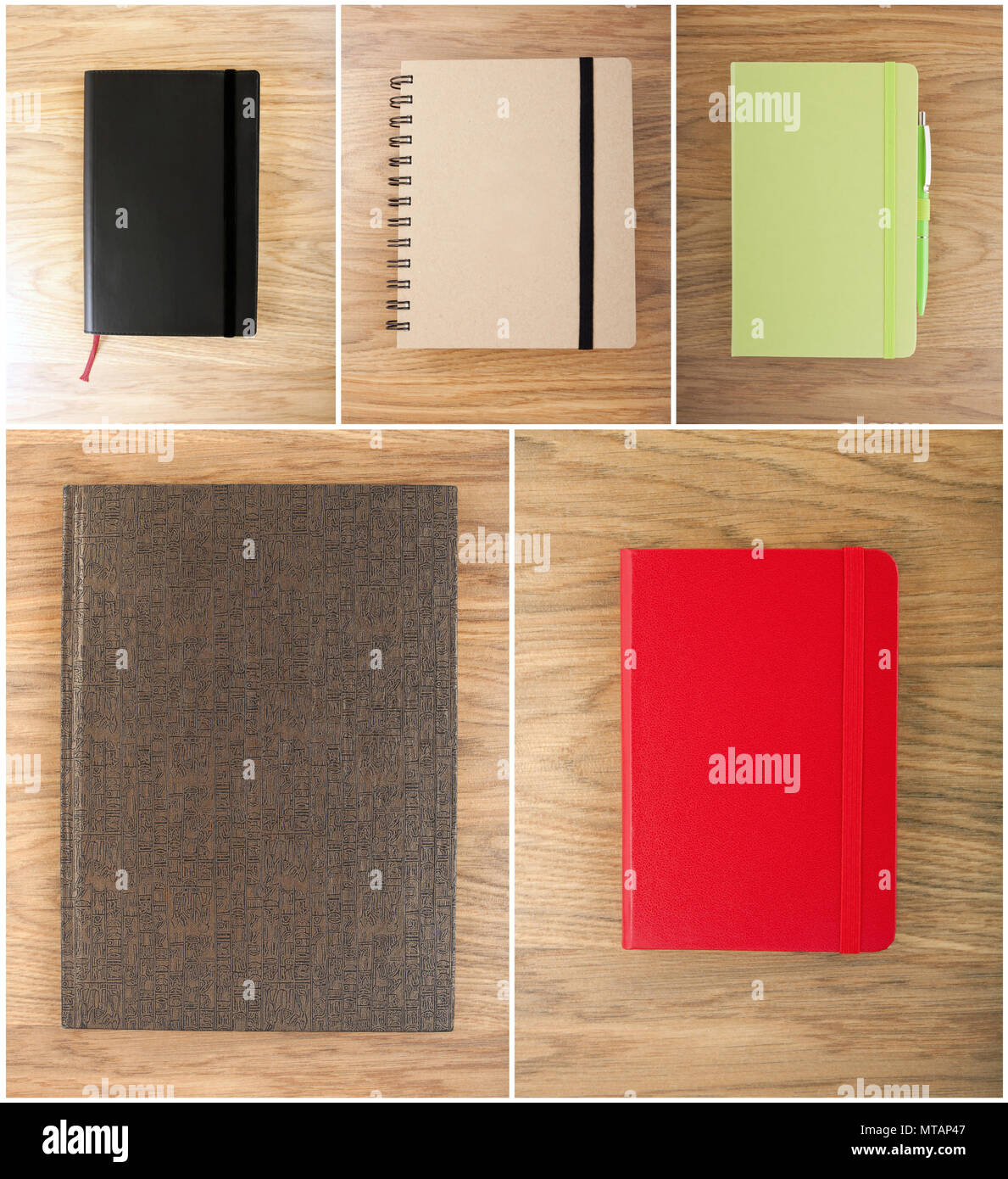 Set closed notebooks on a wooden background Stock Photo - Alamy