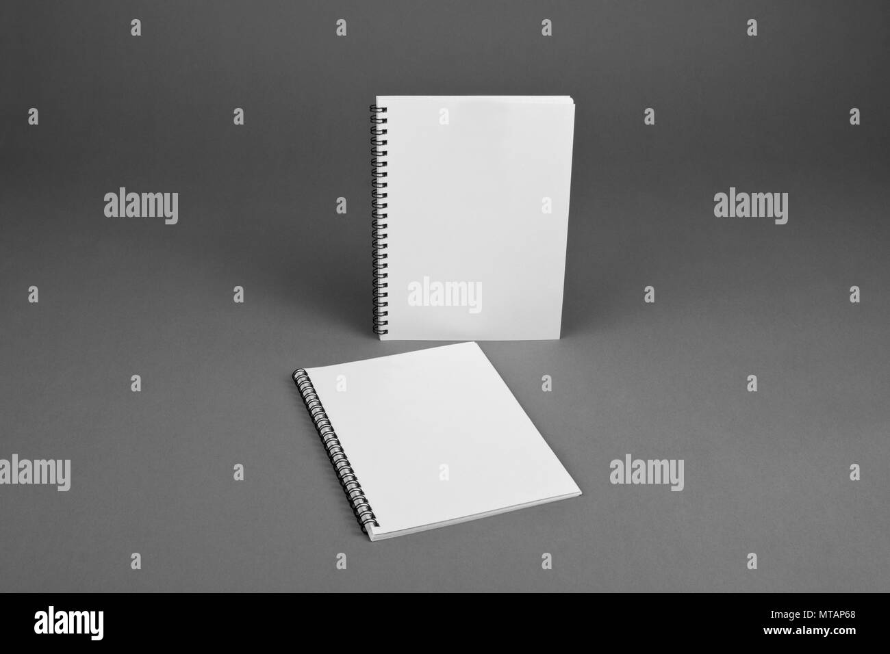 Blank spiral notebook on gray background. Template for your design ...