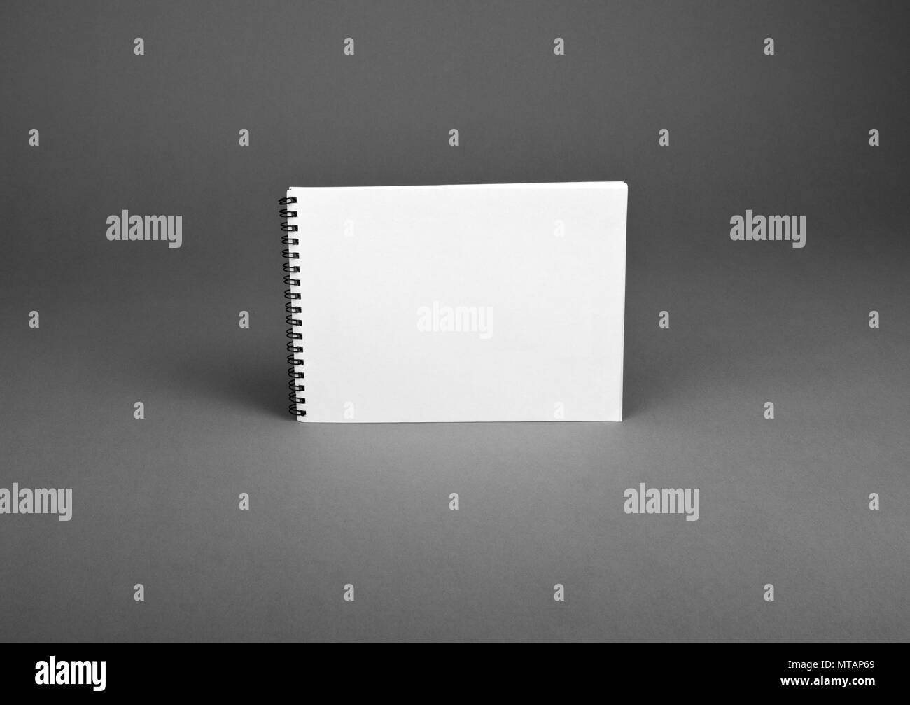 Blank spiral notebook on gray background. Template for your design ...
