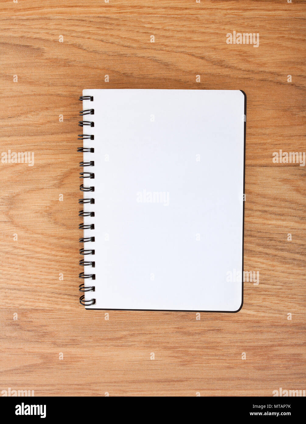spiral notebook paper without line on a table Stock Photo - Alamy