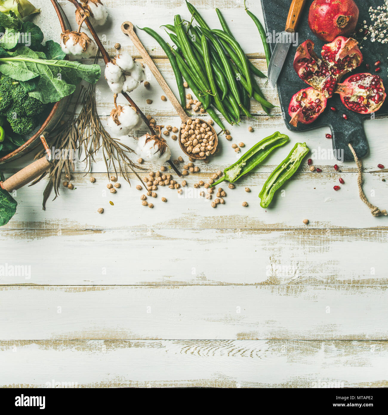 Winter vegetarian food cooking ingredients over white wooden background ...