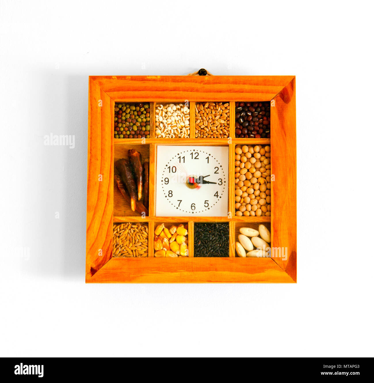 Natural handmade clock with seeds on white background Stock Photo - Alamy