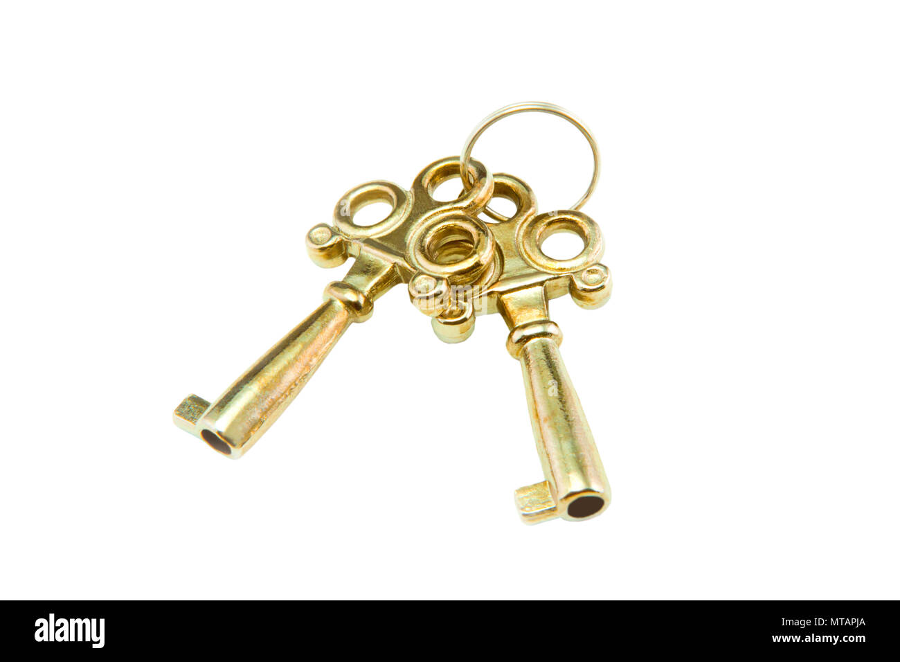 Gold keys isolated on white background Stock Photo - Alamy