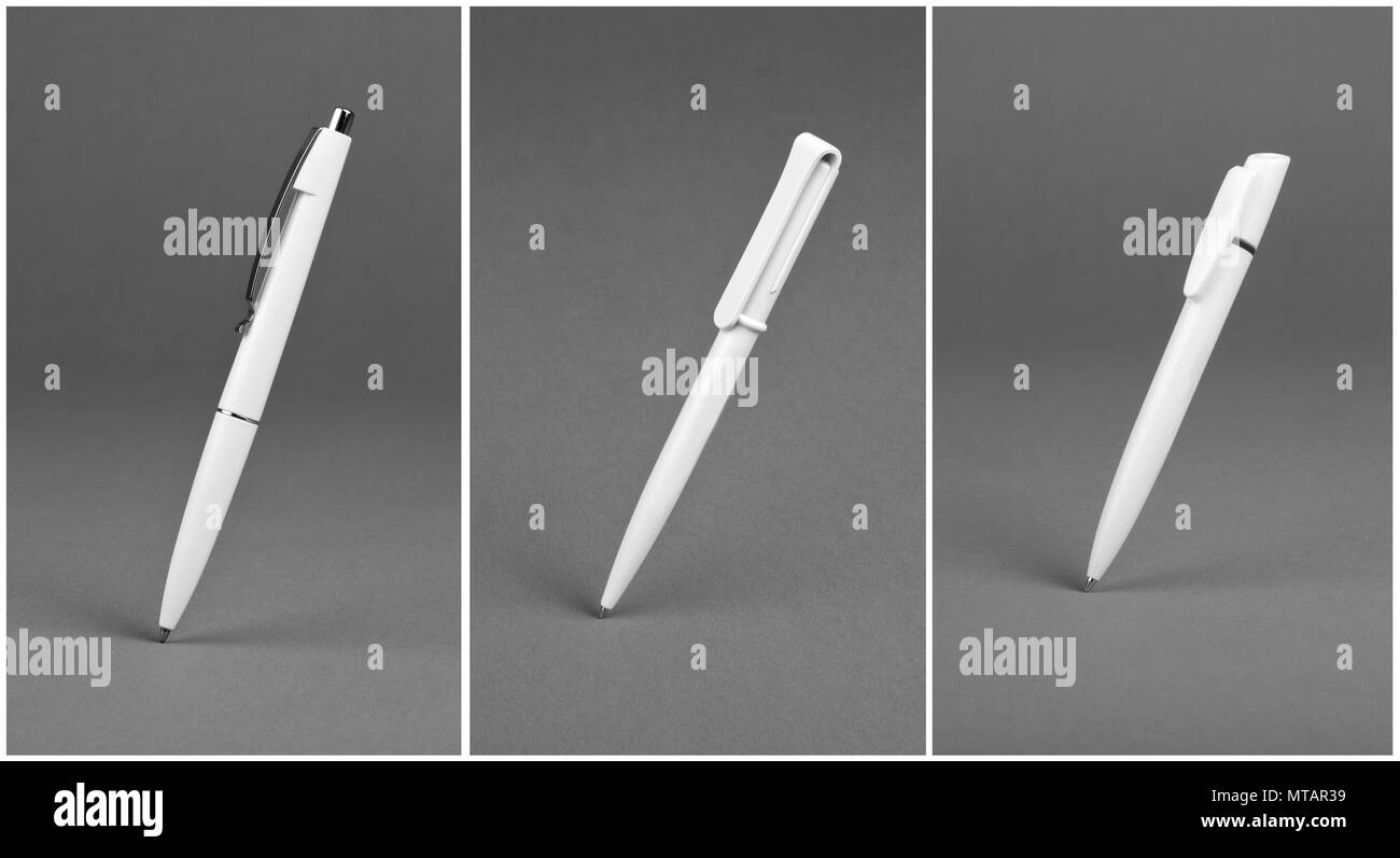 Set of white plastic ballpoint pen on a grey background Stock Photo - Alamy