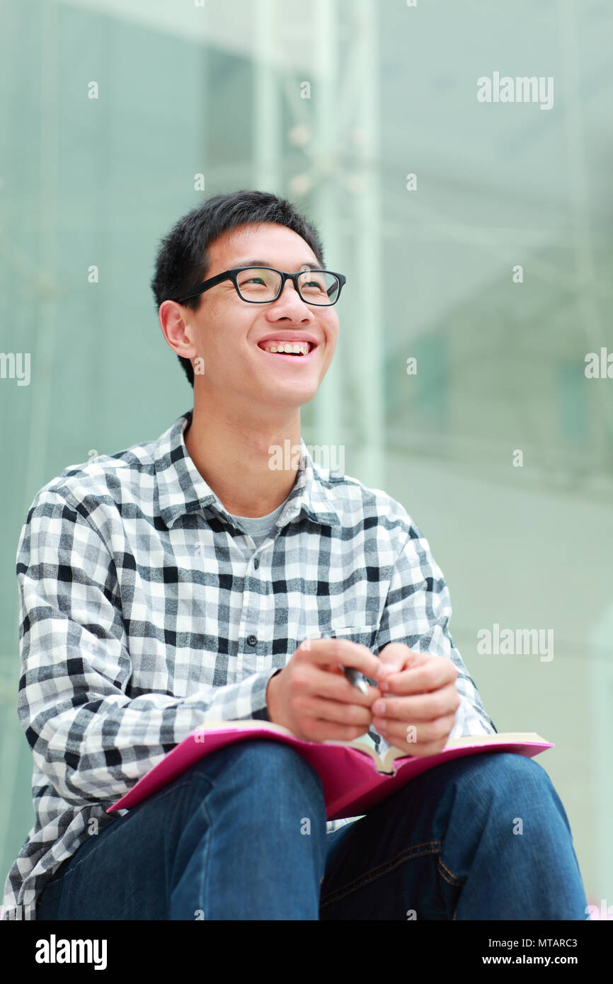 one happy confident young Chinese college student in campus Stock Photo ...