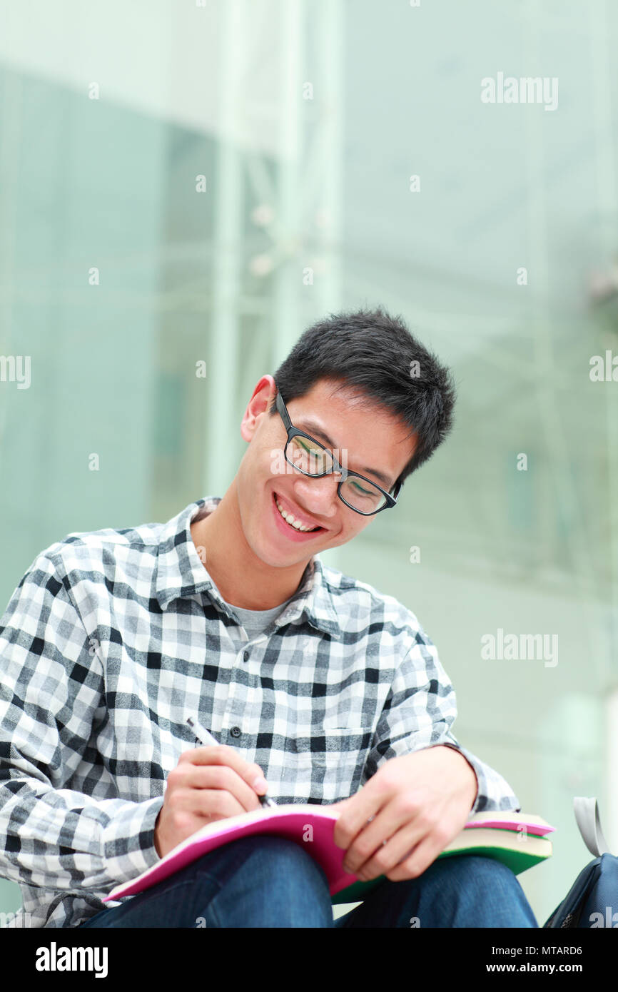 one happy confident young Chinese college student in campus Stock Photo ...