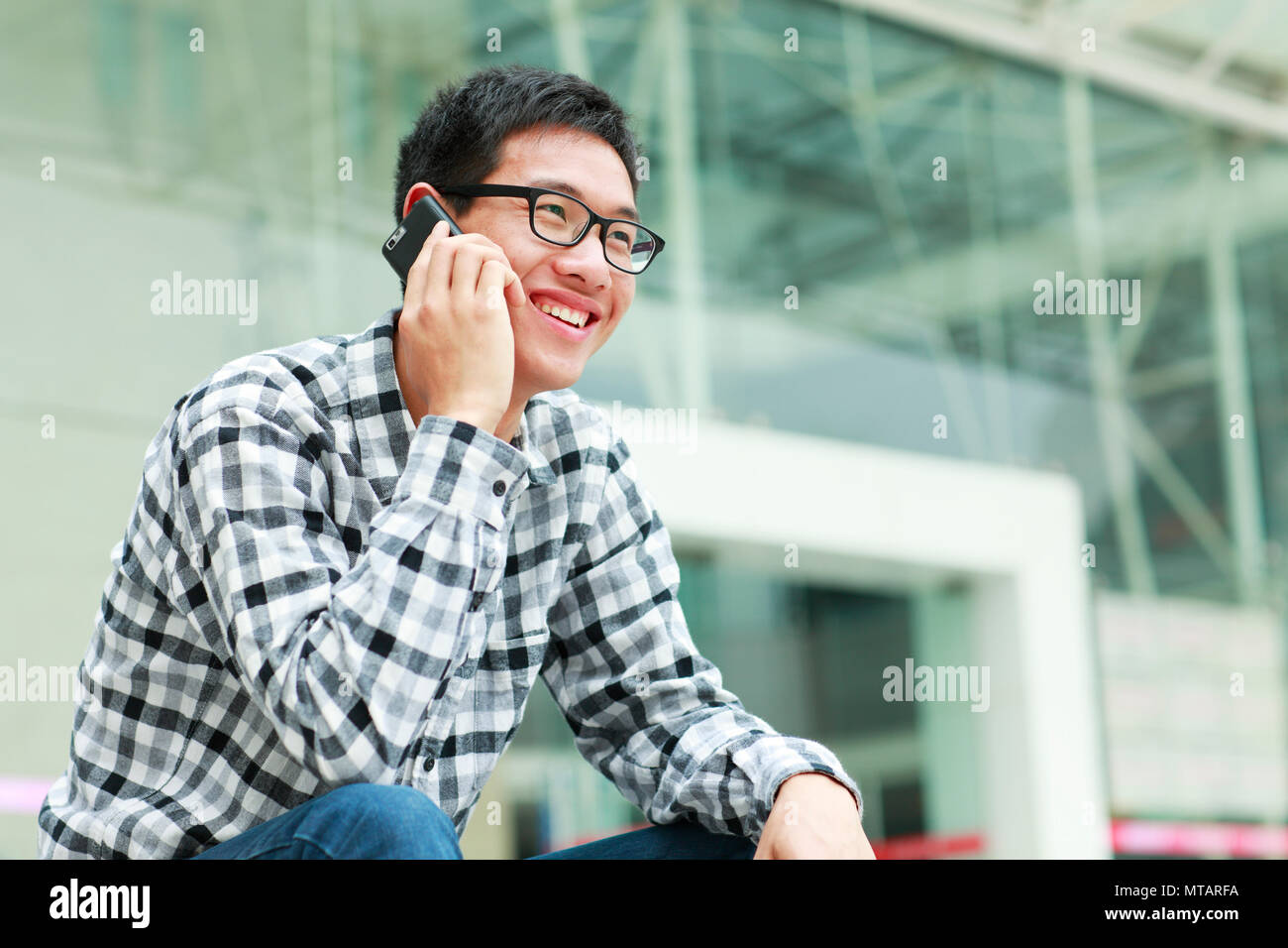 one happy confident young Chinese college student in campus Stock Photo ...