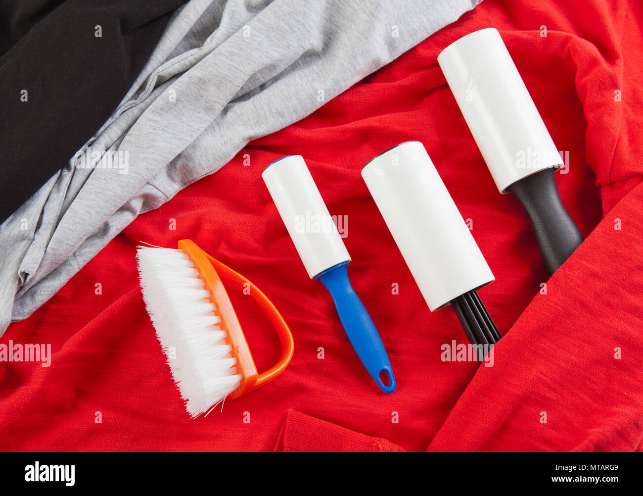 A lint brush used to remove excess fabric and particles from cloth ...