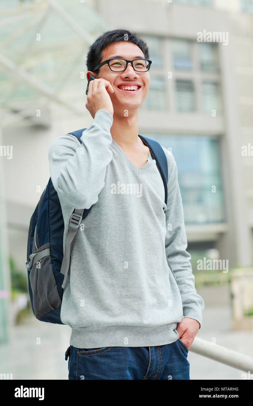 one happy confident young Chinese college student in campus Stock Photo ...