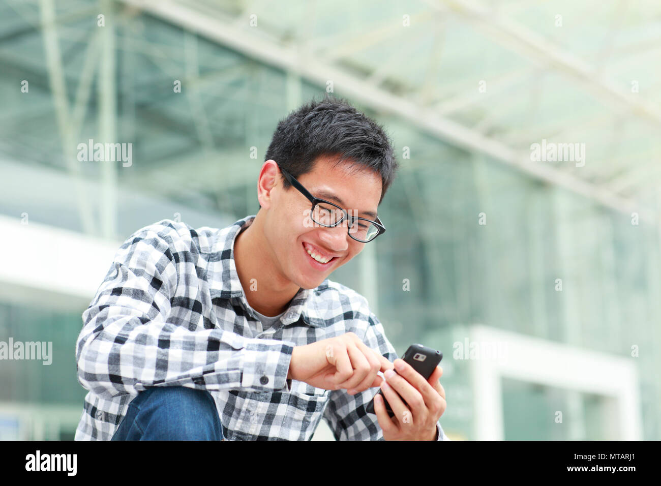 one happy confident young Chinese college student in campus Stock Photo ...