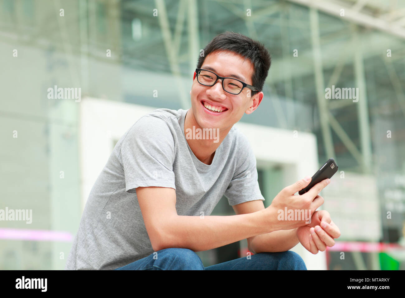 one happy confident young Chinese college student in campus Stock Photo ...