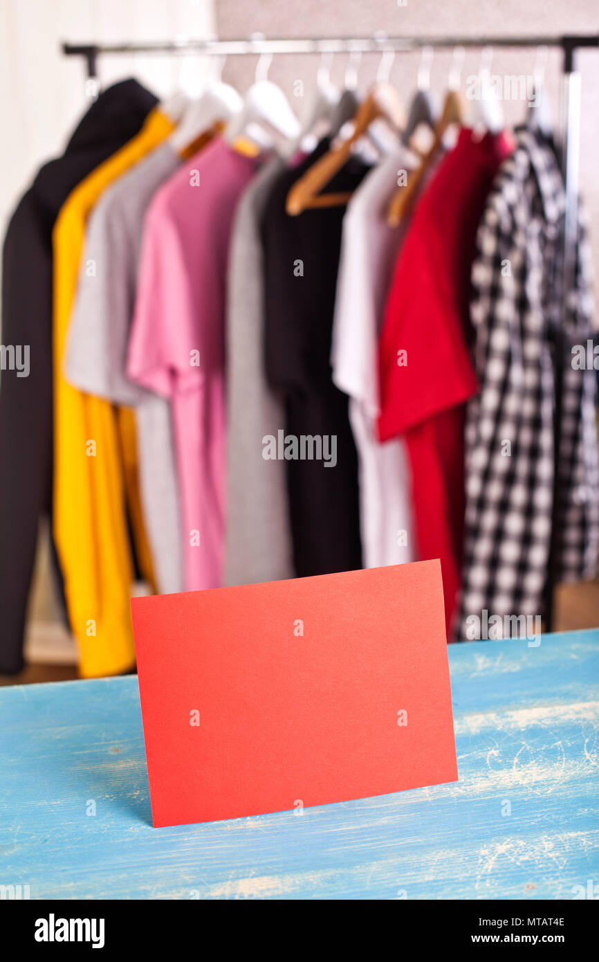 Sale in a clothing store - discount sign at a clothes rack Stock Photo ...