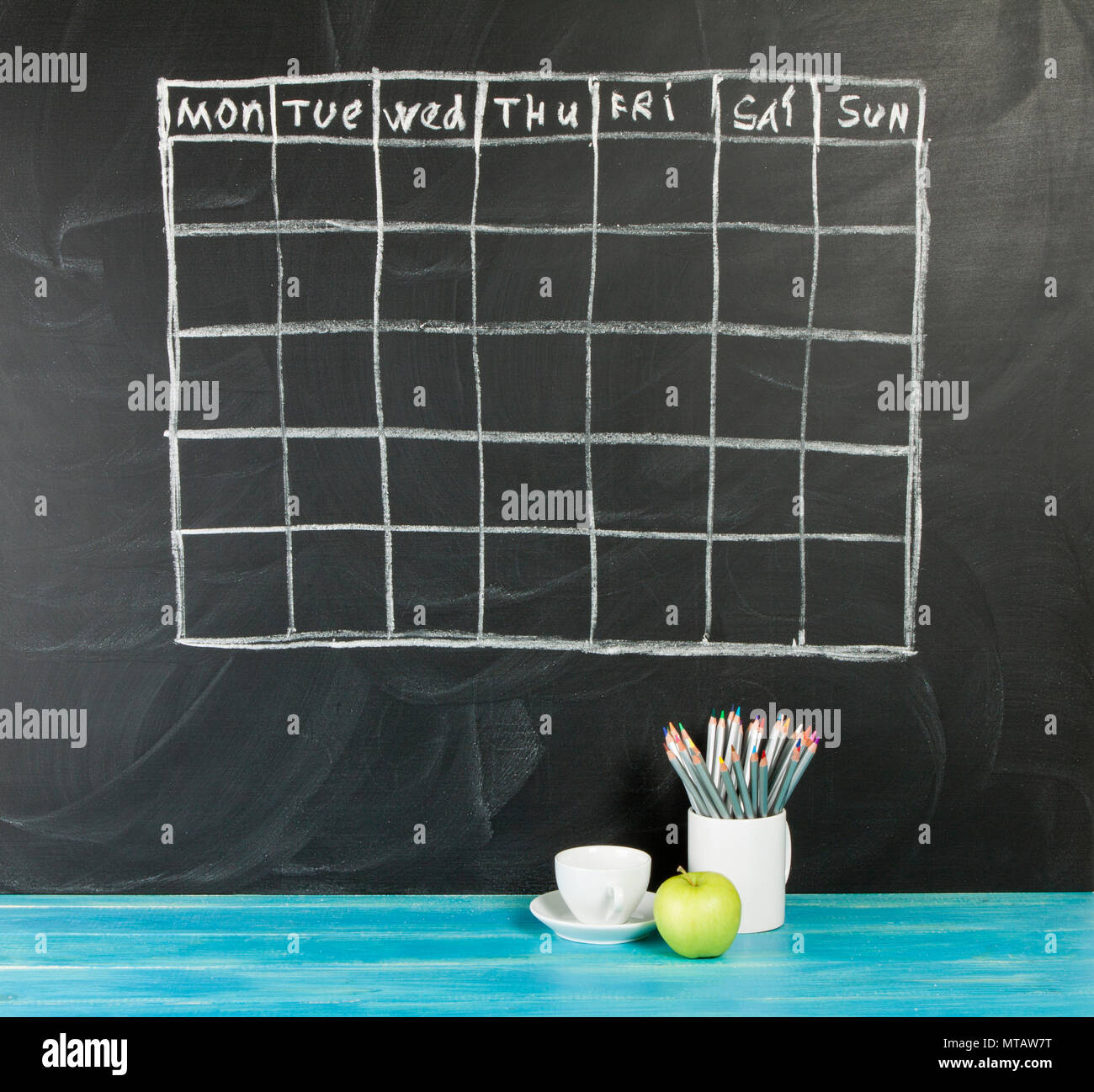 Grid timetable schedule on black chalkboard background Stock Photo - Alamy