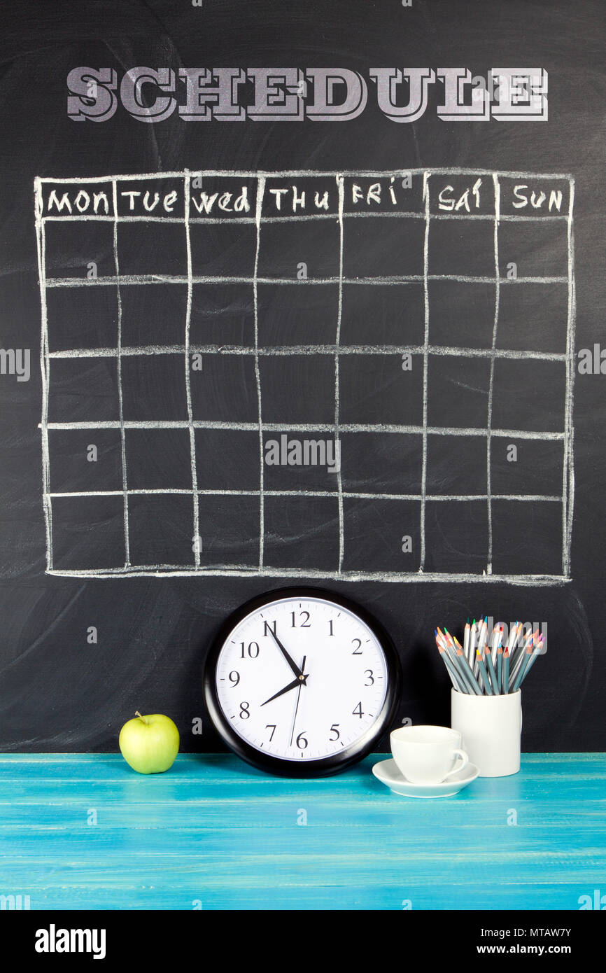 Grid timetable schedule on black chalkboard background Stock Photo - Alamy