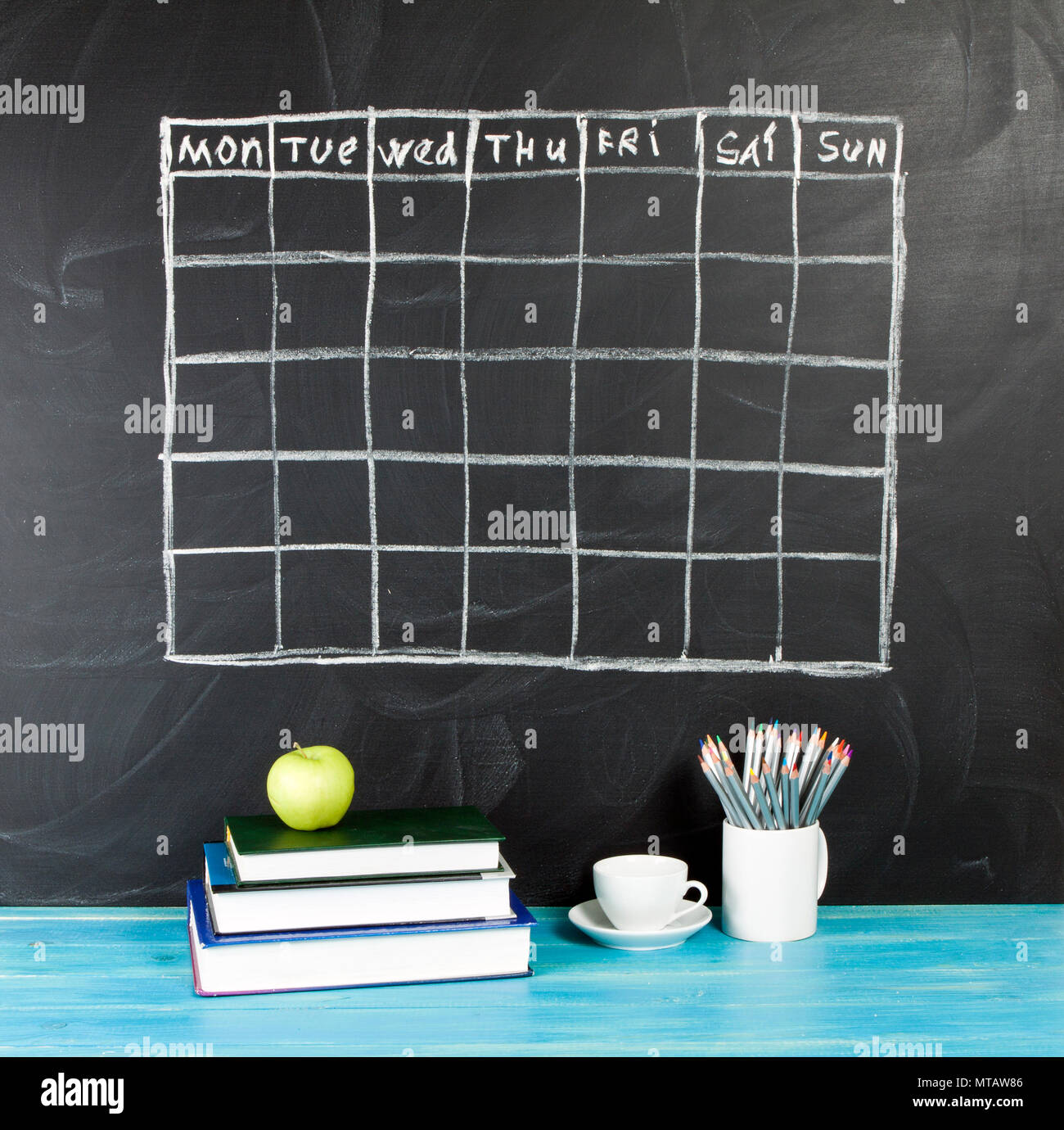 Grid timetable schedule on black chalkboard background Stock Photo - Alamy