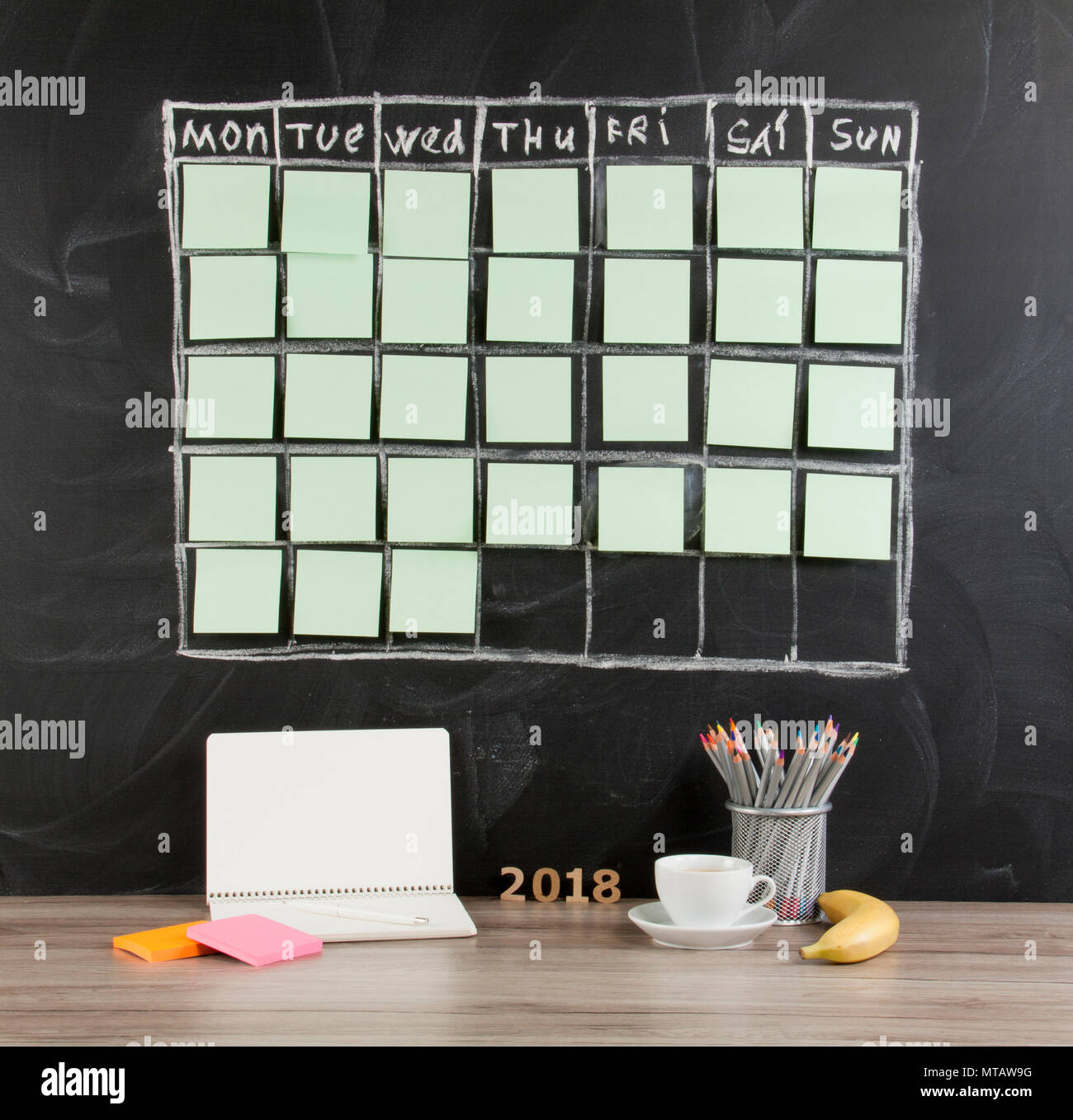 Grid timetable schedule on black chalkboard background Stock Photo - Alamy