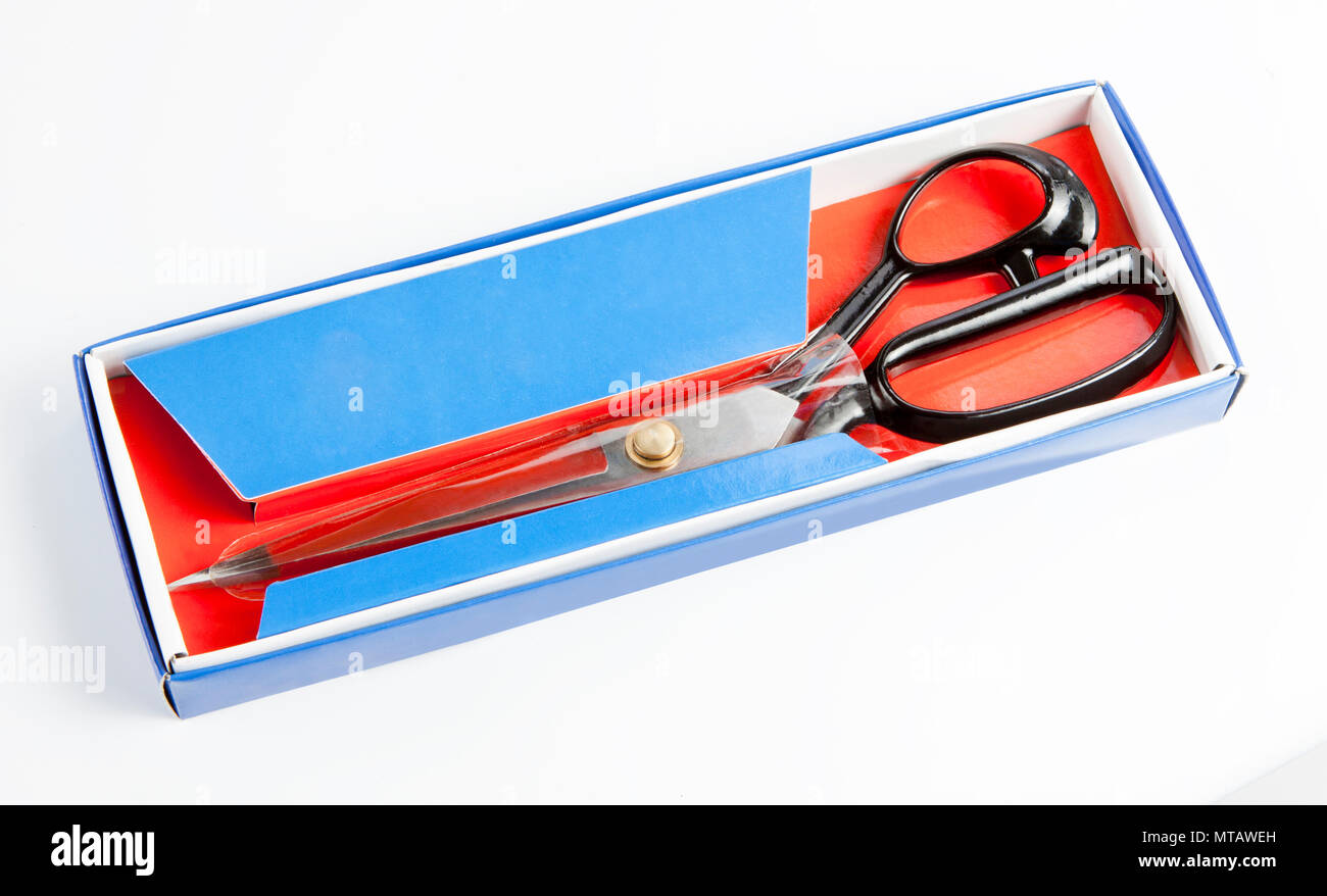 Scissors in a package on a white background Stock Photo - Alamy