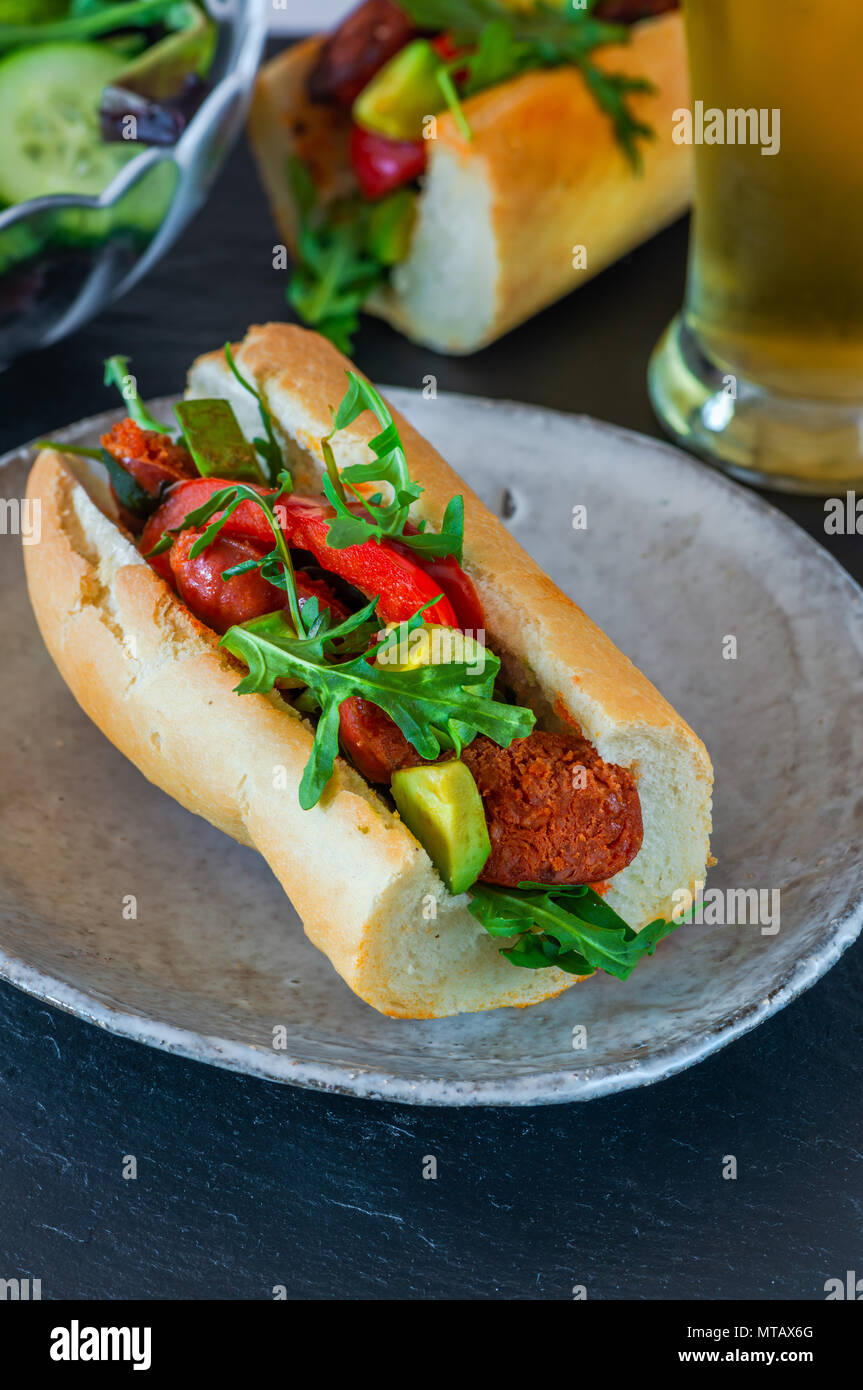 Chorizo rolls with roast red peppers, rocket lettuce and avocado Stock ...