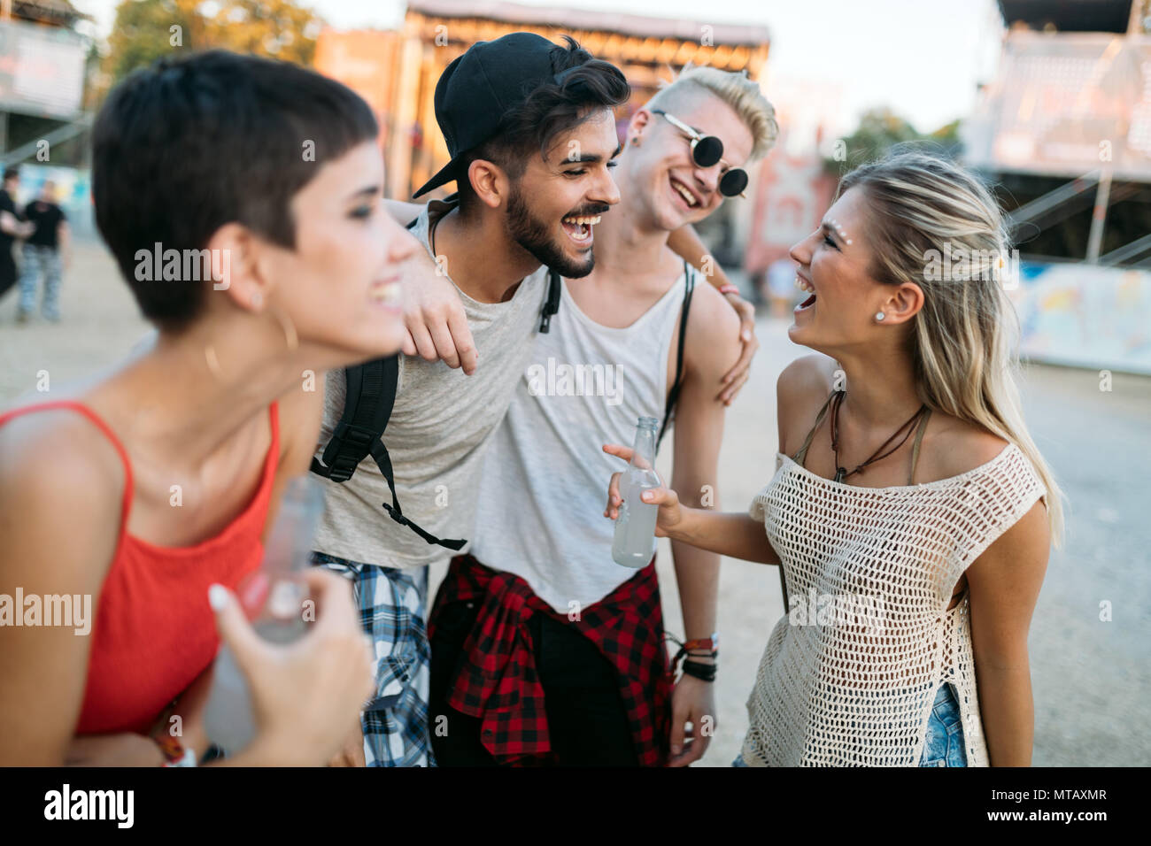 Happy friends having fun at music festival Stock Photo - Alamy