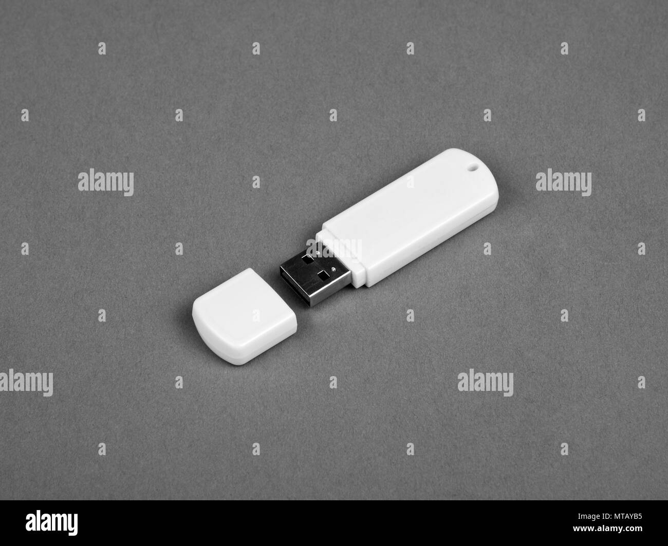 White usb flash drive on gray background Stock Photo - Alamy