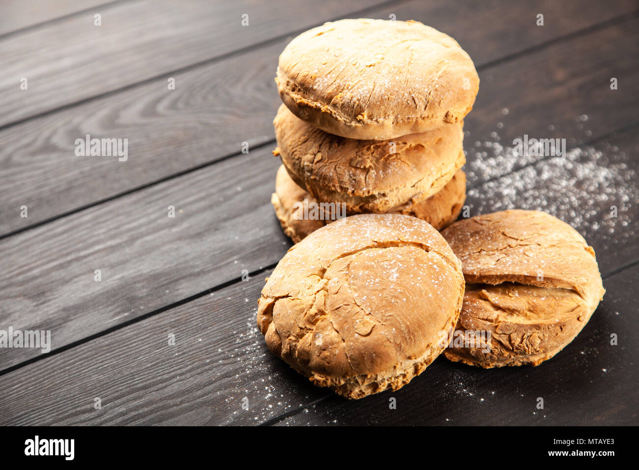 Homemade buns on dark background Stock Photo - Alamy