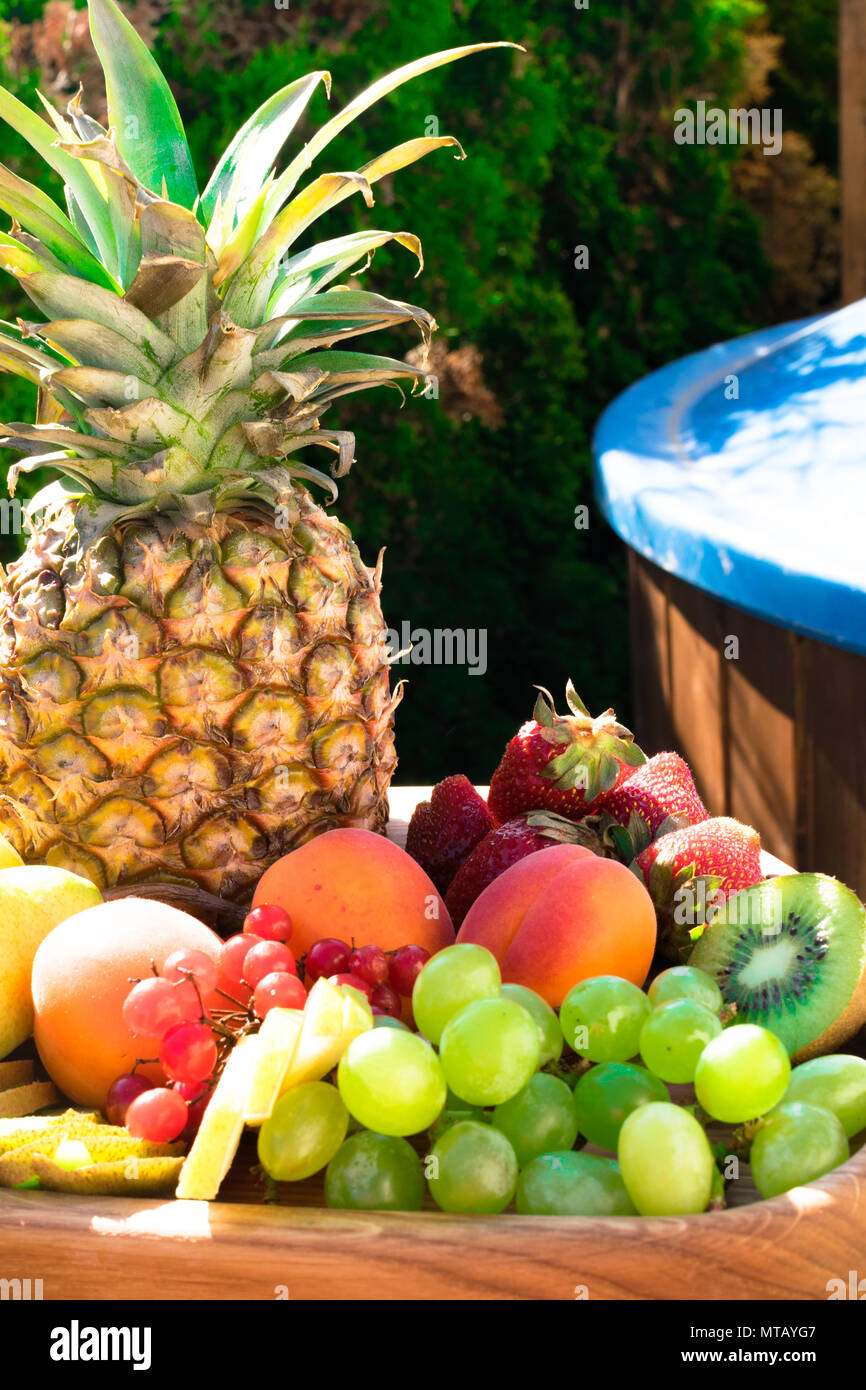 Mix of different exotic fresh colorful Fruits on dark wooden table and ...