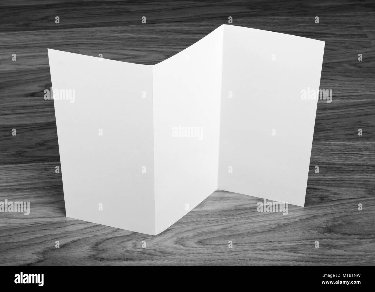 Blank folding page booklet on wooden background Stock Photo - Alamy