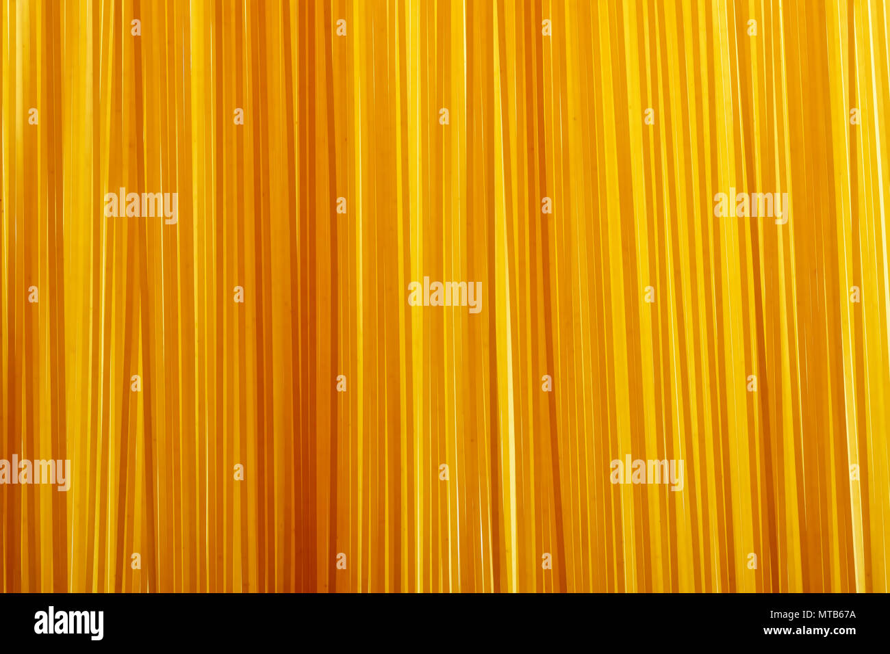 Raw spaghetti background. Top view of vertically aligned uncooked thin ...