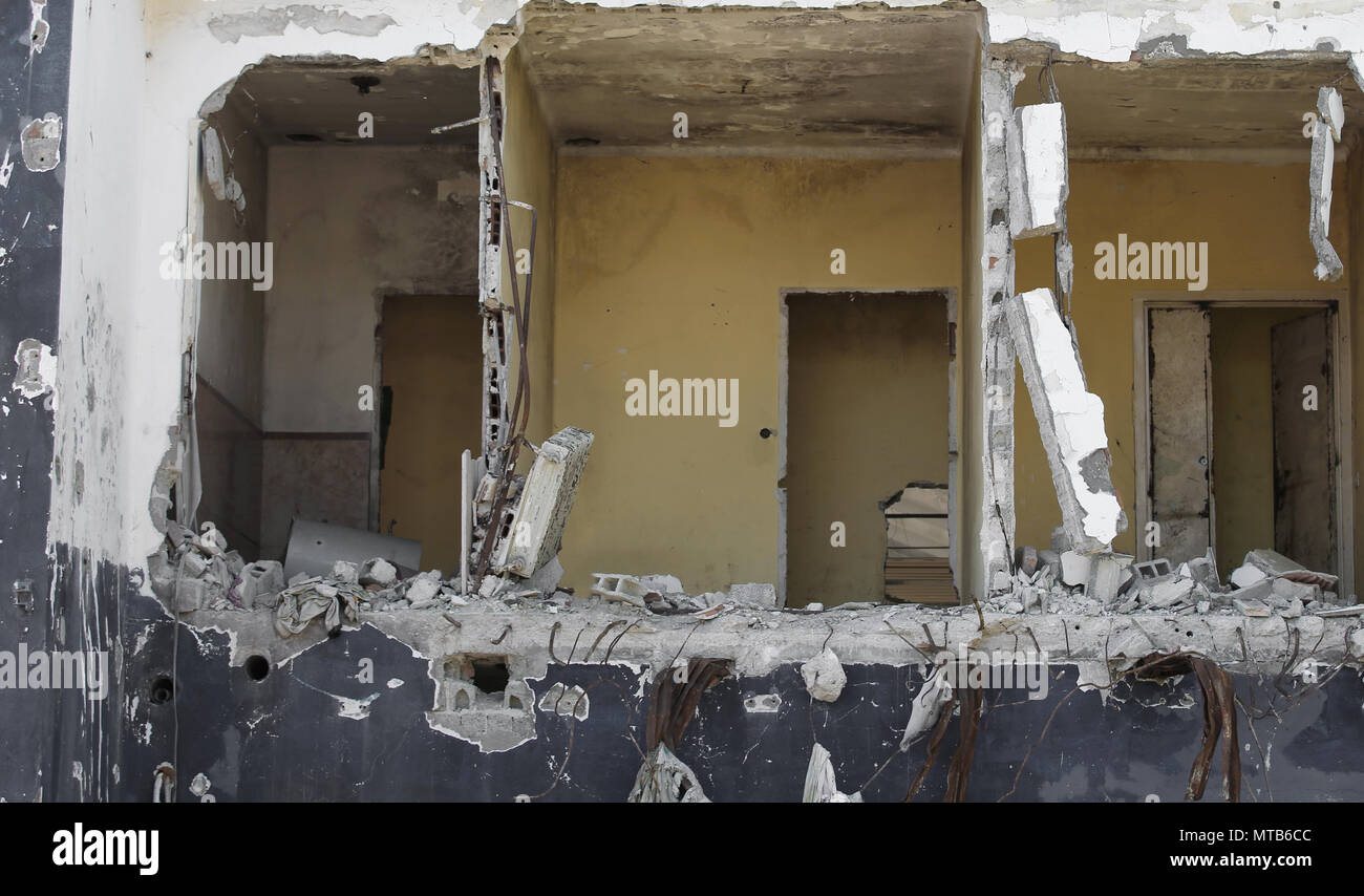 three rooms of a completely destroyed house with collapsed walls and ...