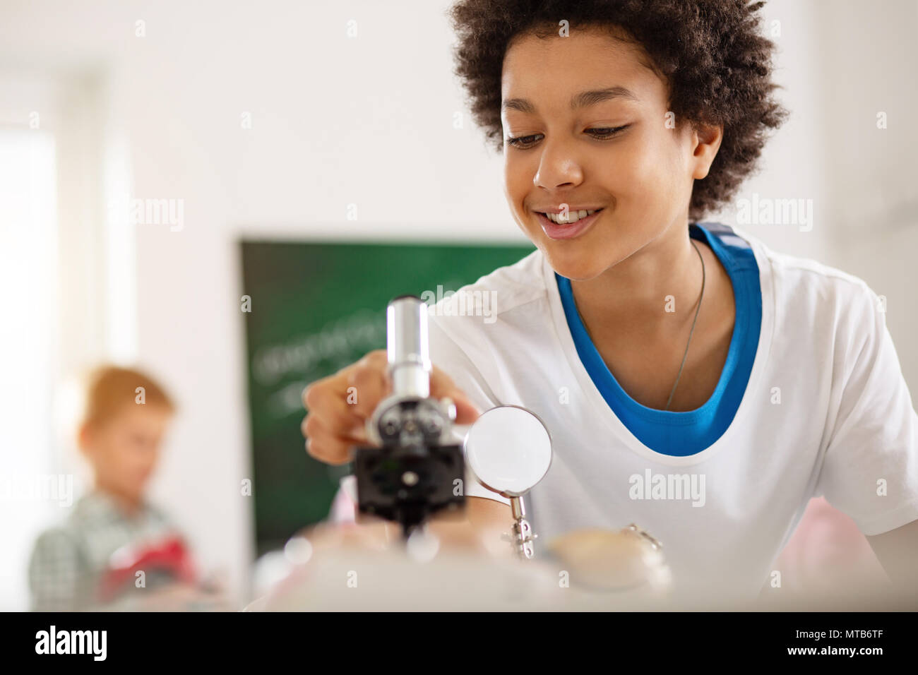 Cheerful happy boy having a lesson Stock Photo - Alamy