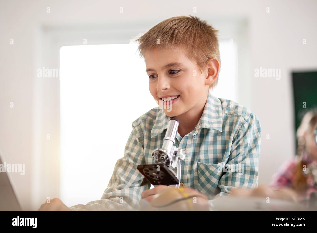 Delighted blonde boy smiling Stock Photo - Alamy