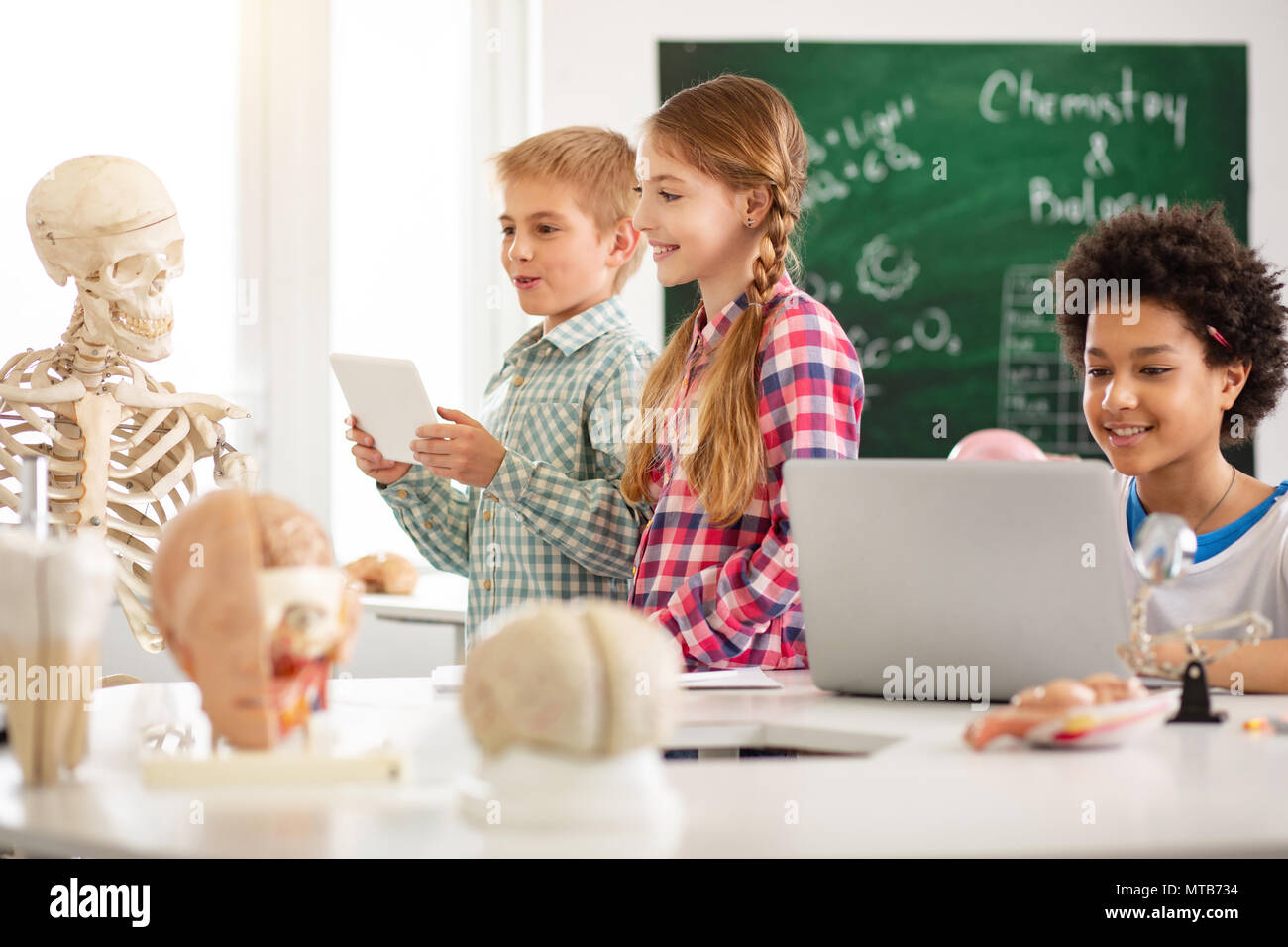Happy delighted children enjoying their class Stock Photo - Alamy