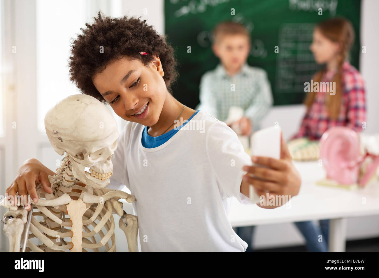 Positive delighted boy smiling Stock Photo - Alamy