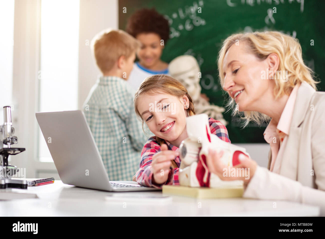 Happy delighted girl smiling Stock Photo - Alamy