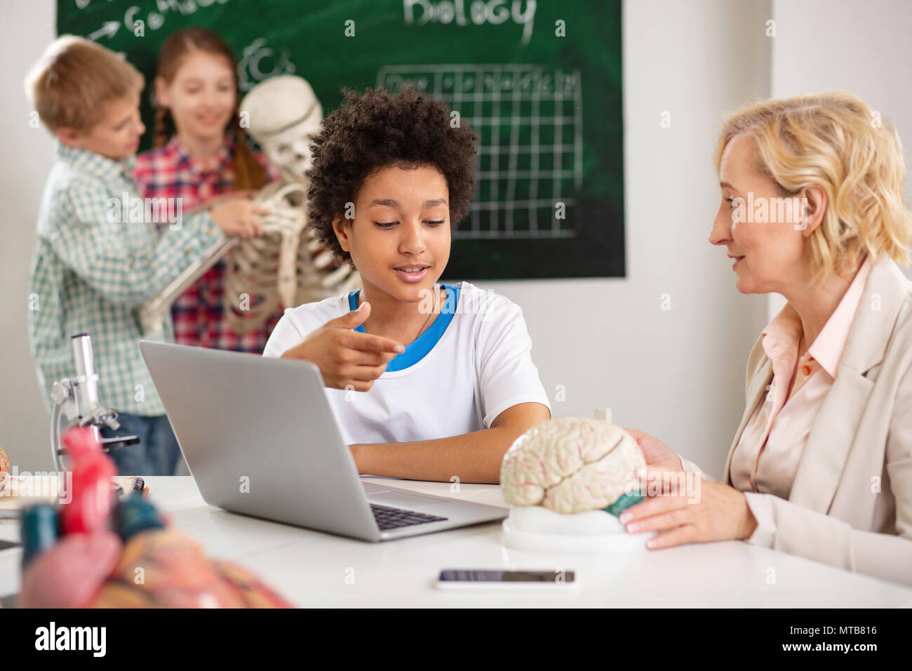 Smart nice boy having a test Stock Photo - Alamy