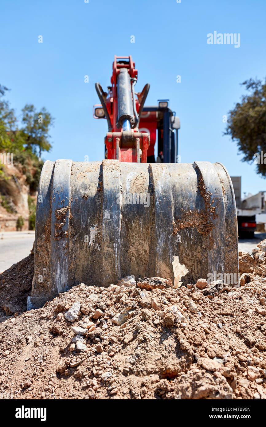Close up shot of an earth moving bucket of a digger in the soil Stock ...