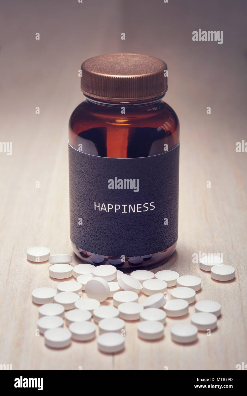 A drug container with black label written happiness on it. White pill ...