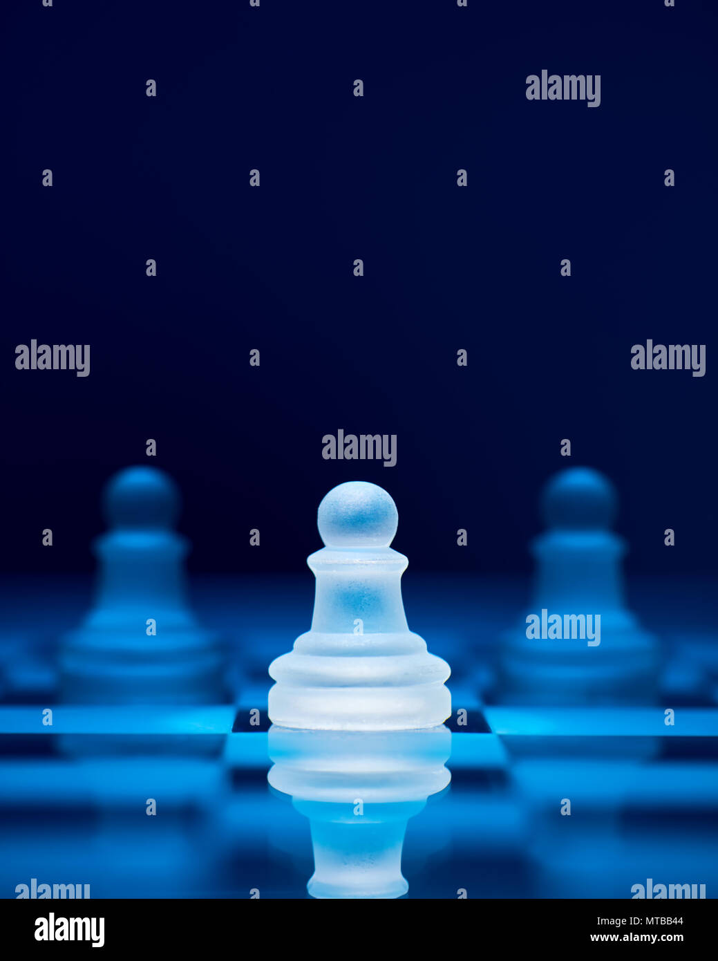 Chess game pieces. Three pawns on the chess board Stock Photo - Alamy