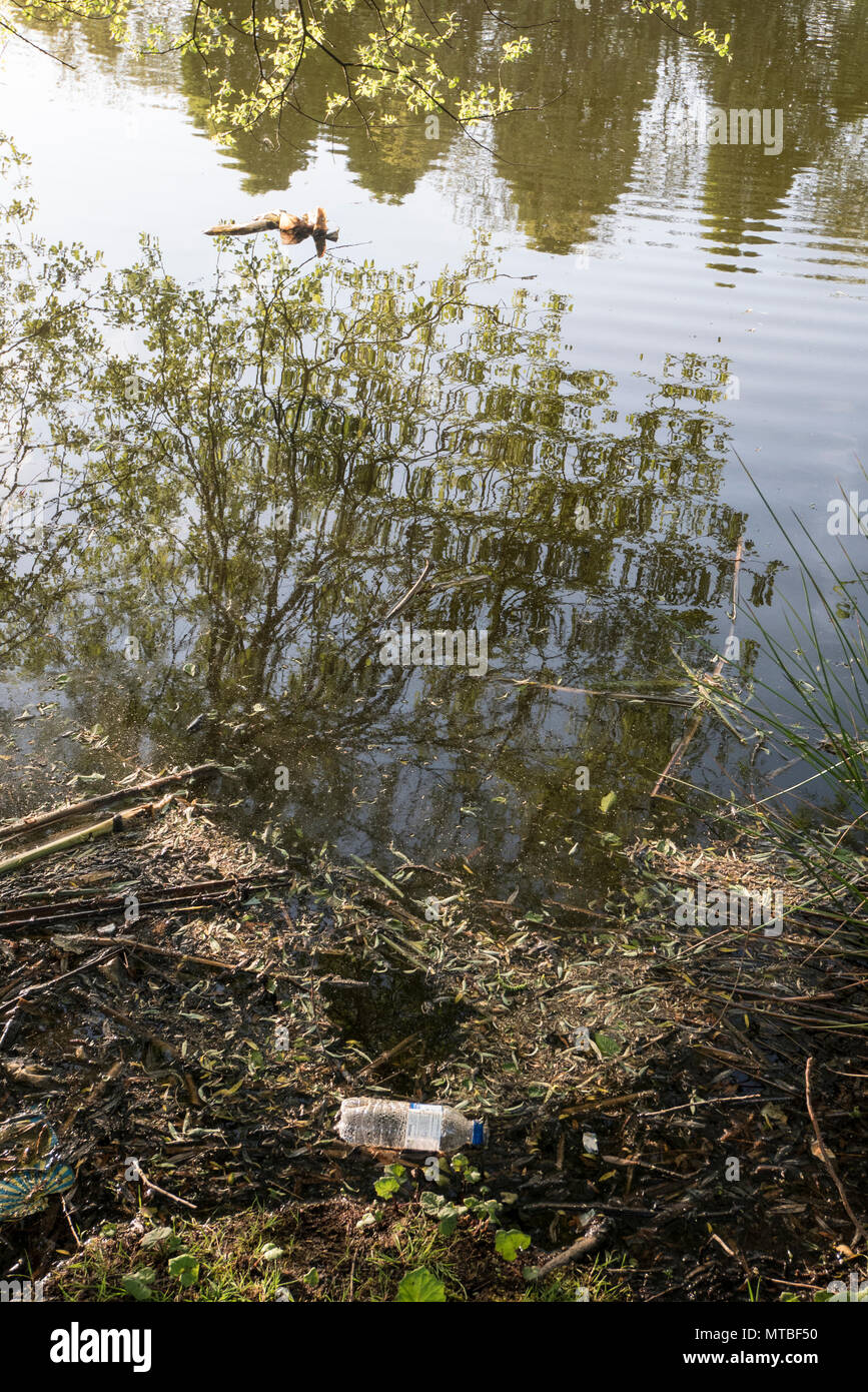 Plastic bottle litter in water Stock Photo - Alamy