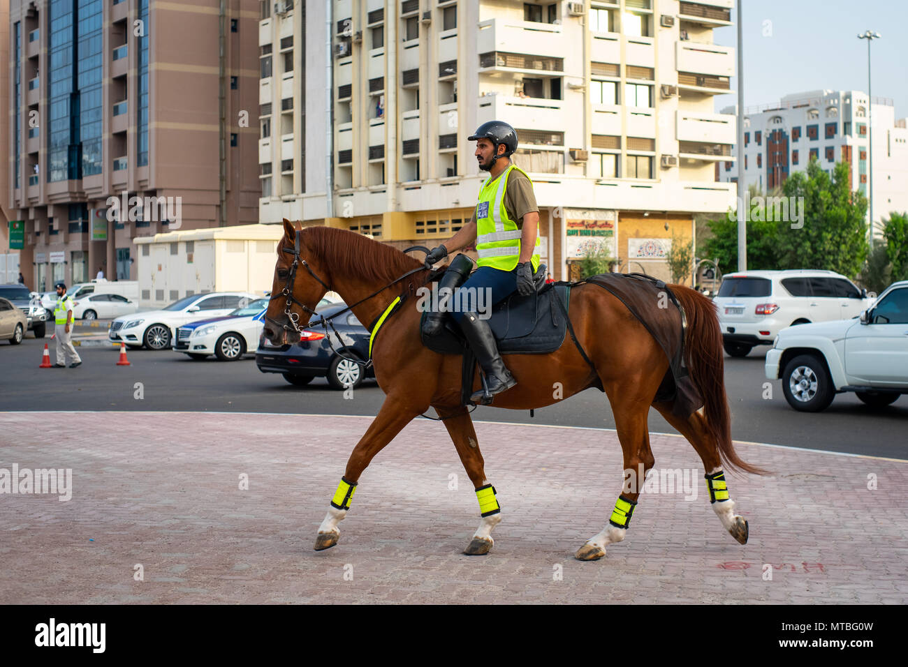 Abu Dhabi Mounted Police patrolling the city on horse back Stock Photo ...