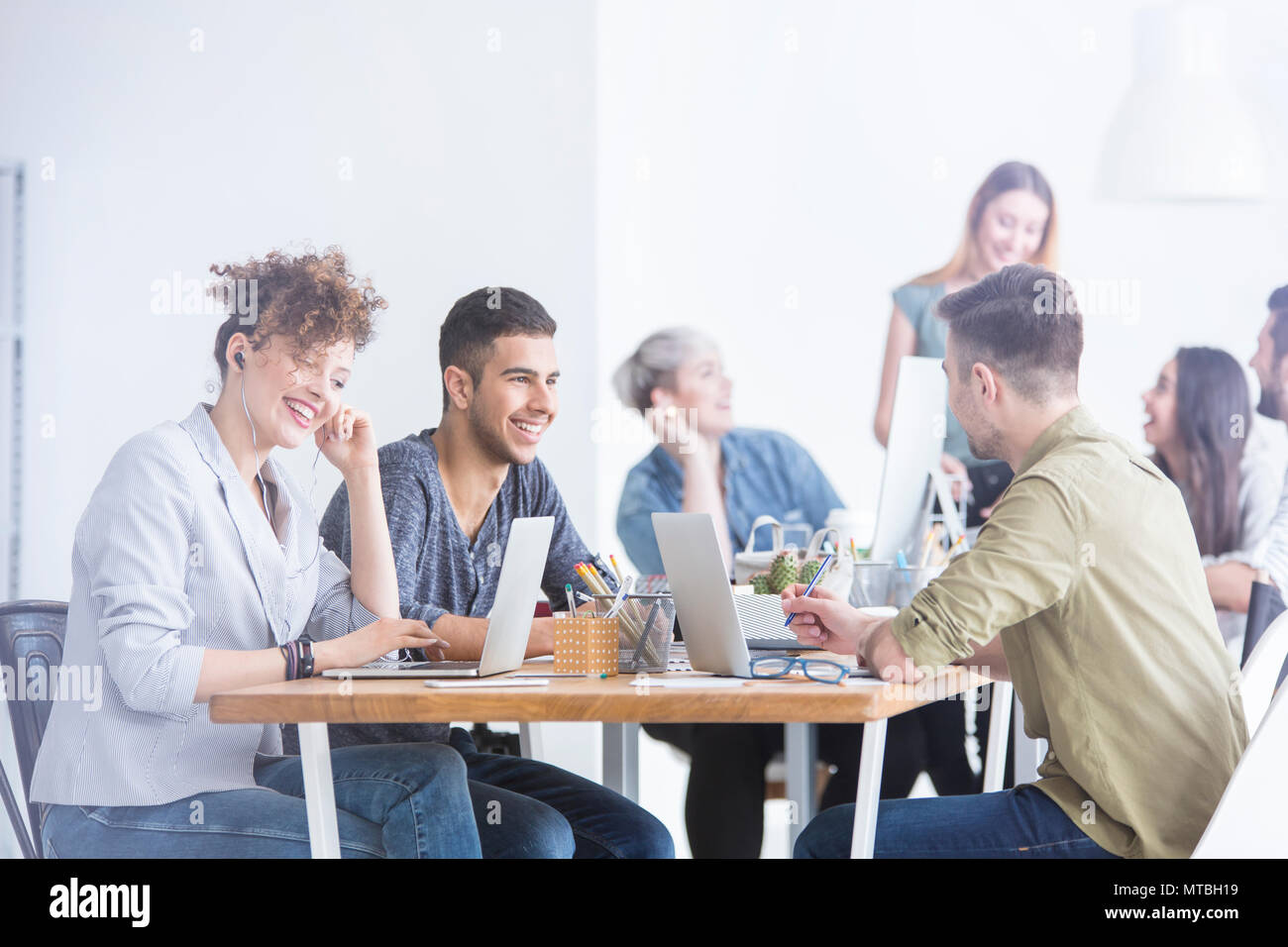 Multicultural colleagues having fun at break at work Stock Photo - Alamy