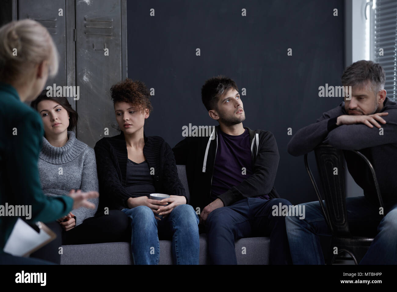 Group of young people during addiction treatment Stock Photo - Alamy