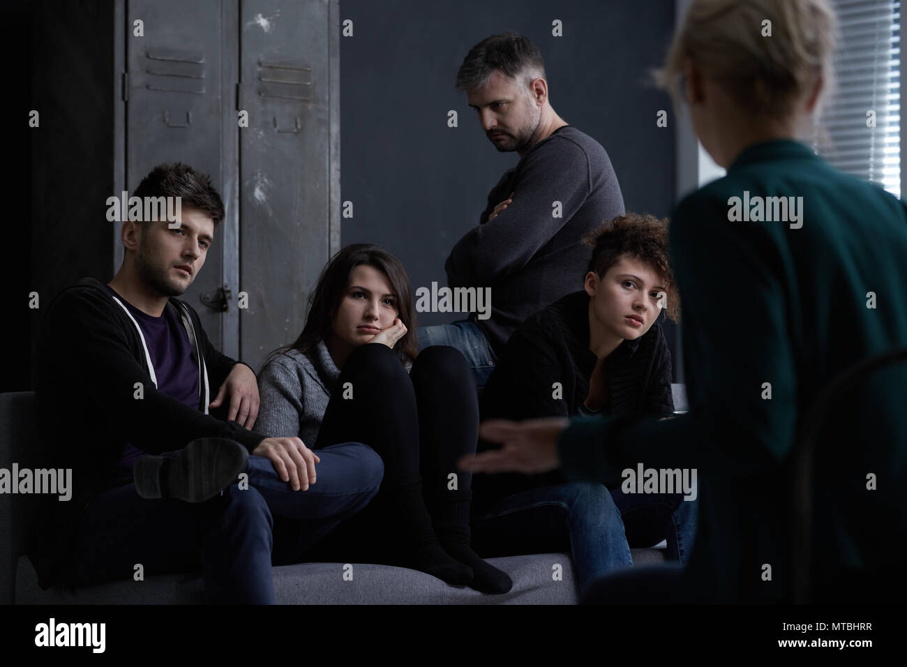 Young people participating in group therapy for alcohol addiction Stock ...