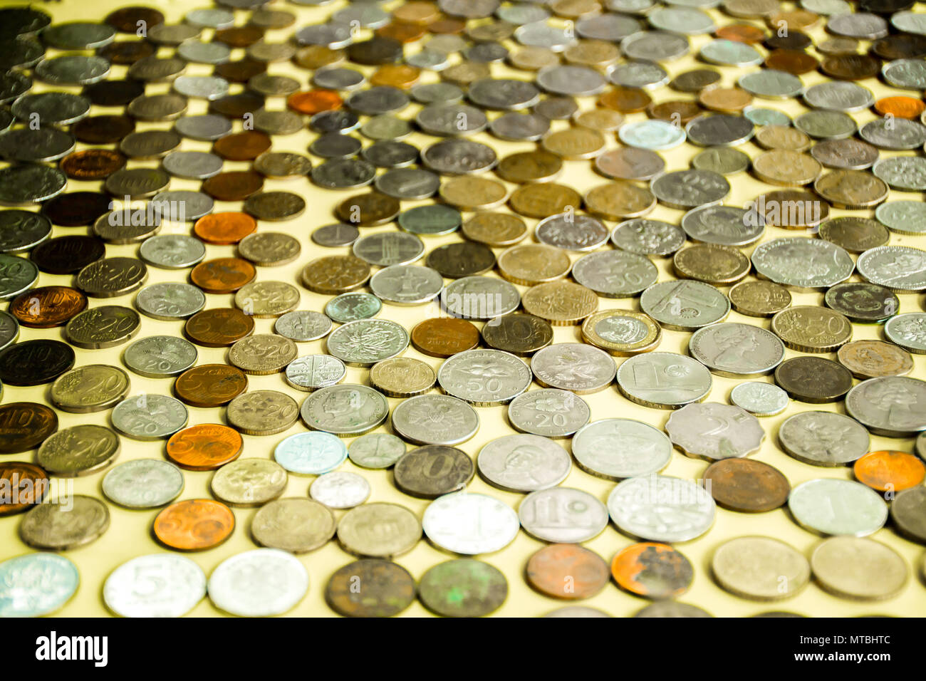 Collection of colorful coins of world Stock Photo - Alamy