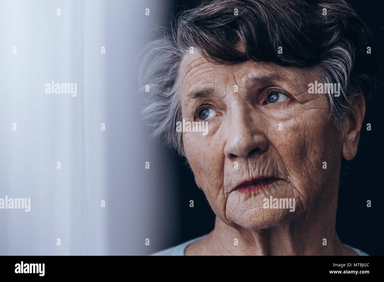 Old woman window dementia hi-res stock photography and images - Alamy