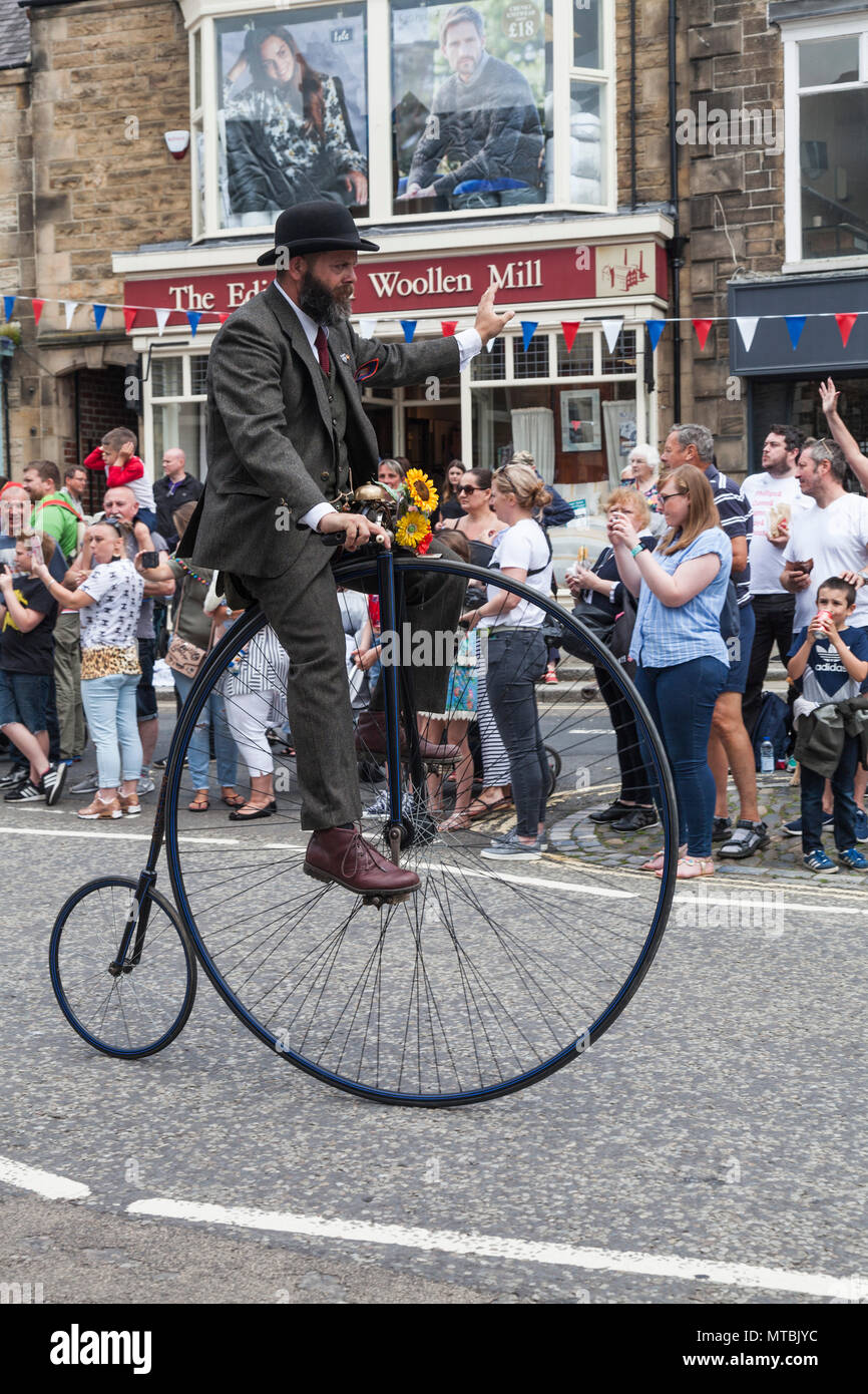 Man riding a penny farthing bicycle hi-res stock photography and images ...